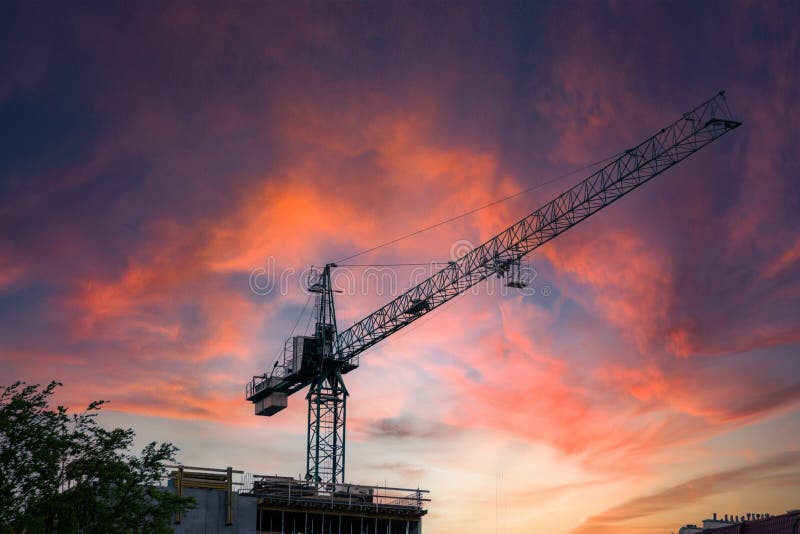 Construction Crane on the Sunset Stock Photo - Image of crane, people ...