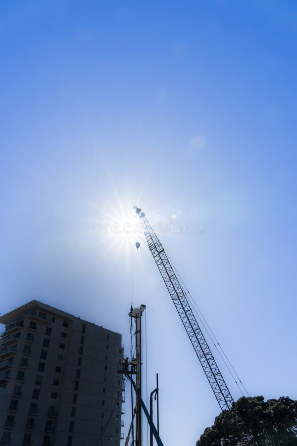 Construction Crane Topped by Sun Star-burst Stock Image - Image of ...