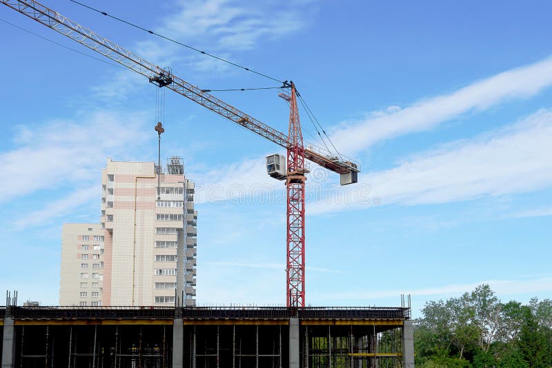 A Construction Crane Works in the Morning at the Facility. Boom Crane ...