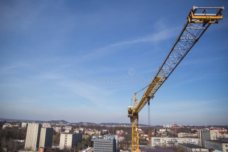 A Construction Crane during Work at a Construction Site Stock Photo ...