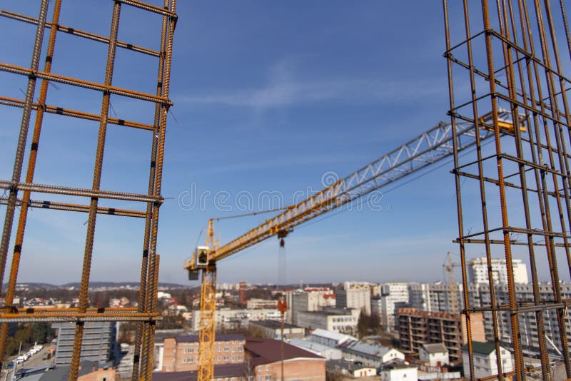 A Construction Crane during Work at a Construction Site Stock Photo ...