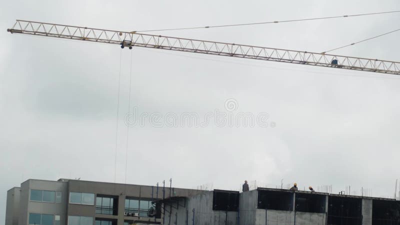 Construction Crane and Workers on a Building Site Stock Footage - Video ...