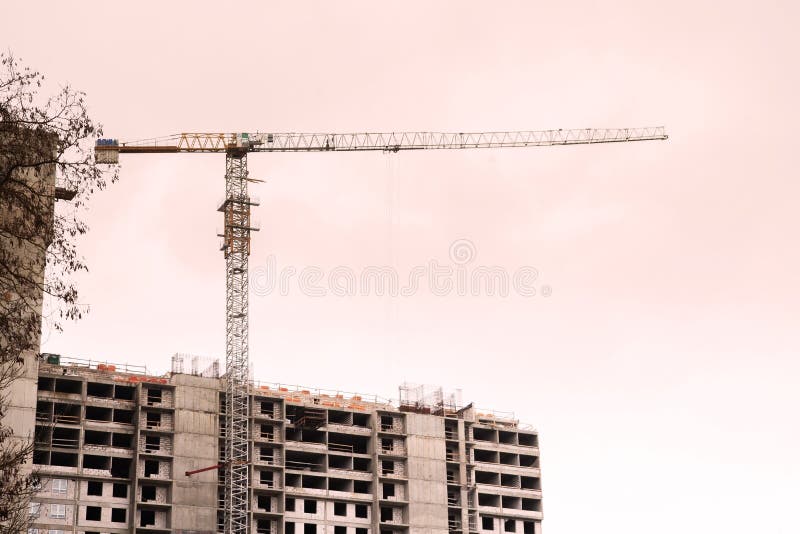 Construction Crane is Working on the Construction of a Multi-storey ...