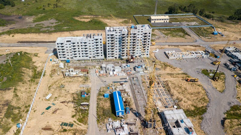 Construction Crane Works on the Construction of a Residential House ...