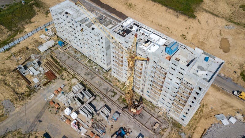 Construction Crane Works on the Construction of a Residential House ...