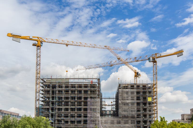 Construction Cranes at Big Building Construction Site Stock Image ...