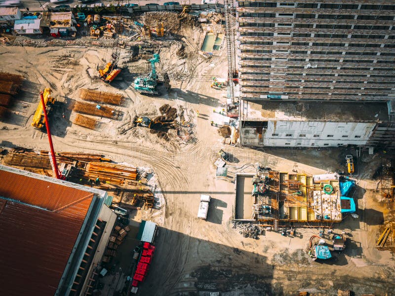 Construction Cranes and Excavators Machinery Working in Development on ...