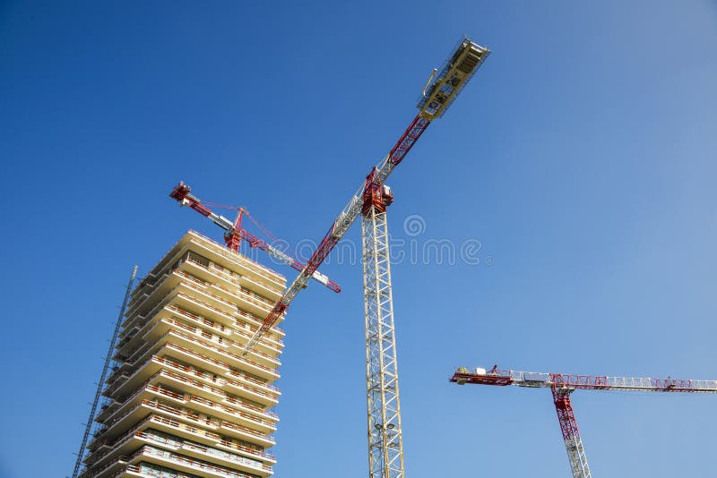 Construction Cranes at a House Building Site Stock Photo - Image of ...