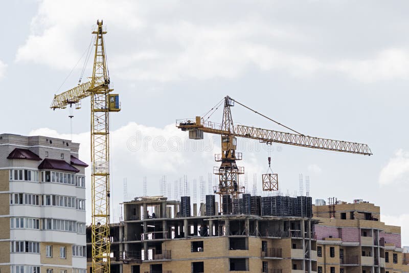 Construction Cranes and a Line of a Multistory Building Editorial Photo ...