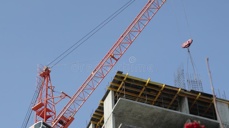 Construction Cranes Move Building Materials and Work on the ...