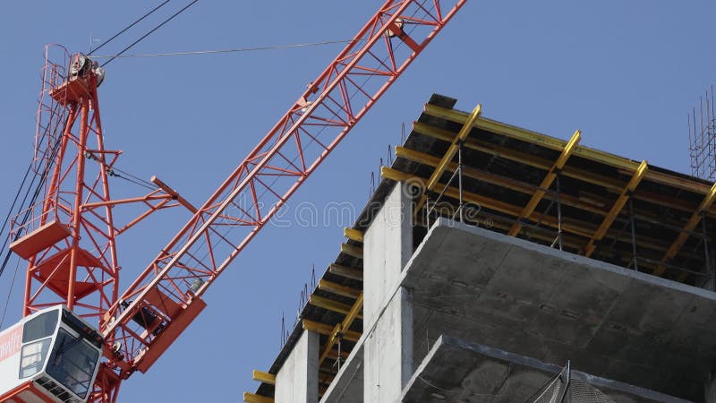 Construction Cranes Move Building Materials and Work on the ...