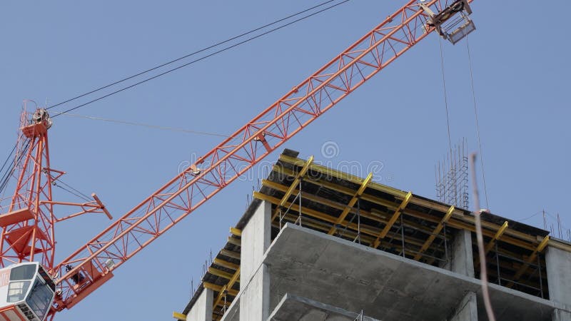 Construction Cranes Move Building Materials and Work on the ...