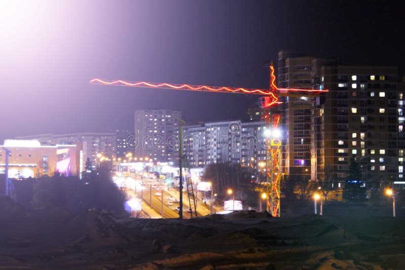 Construction Cranes at a Construction Site, Colored Light at Night ...