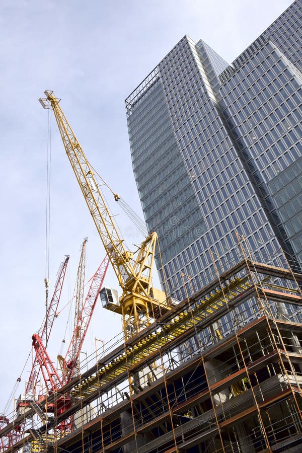 Construction cranes stock photo. Image of skyscraper - 86377600
