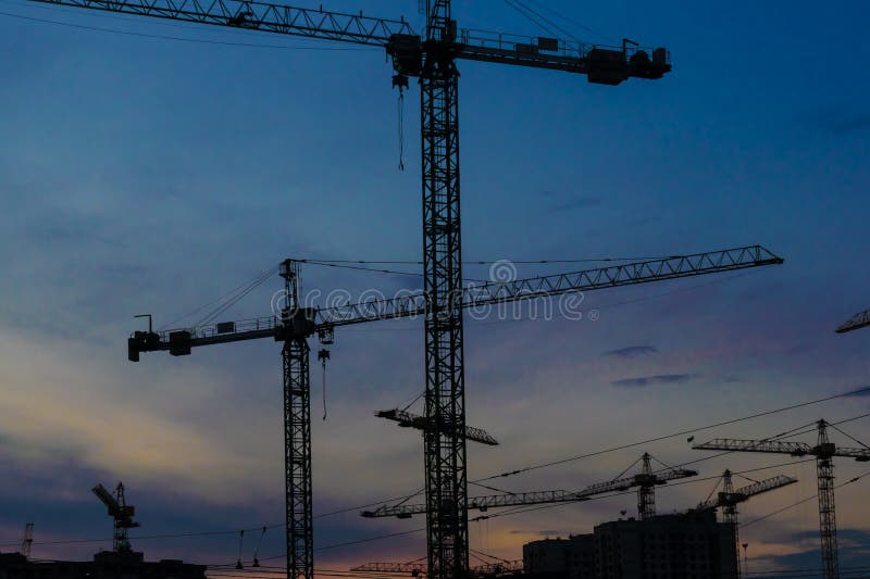 Construction Cranes on Sunset Stock Image - Image of equipment ...