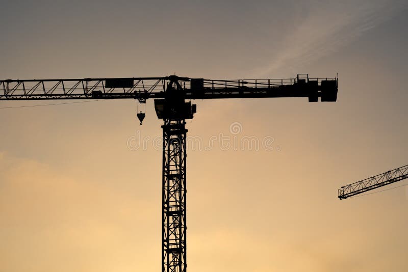 Construction Cranes in the Sunset Sky Stock Image - Image of height ...
