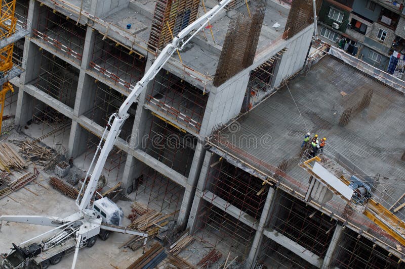 Construction Crew Working with Mini Spider Crane on Building Stock ...