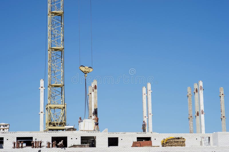 Construction Crew Working in the Summer on the Construction of a Brick ...