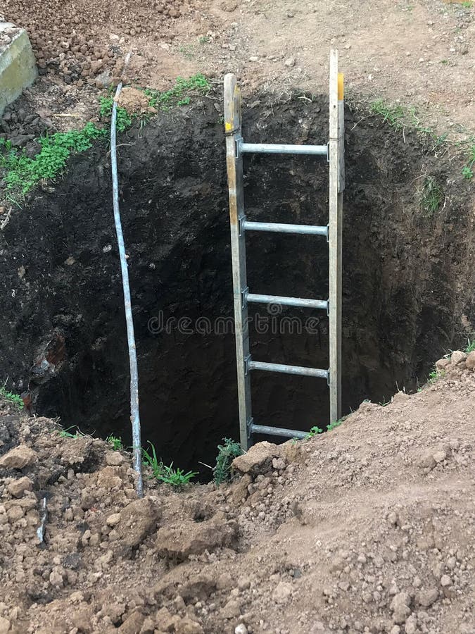 Construction of a Deep Well with a Ladder To Go Down. Building Site ...