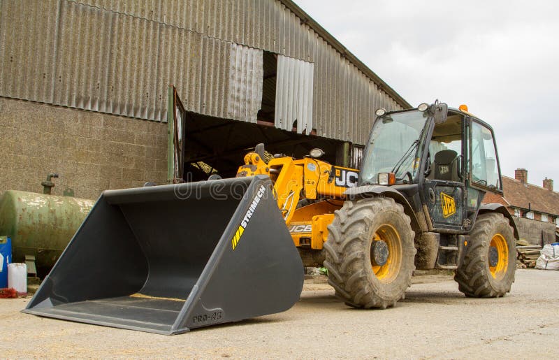 Construction Digger Loader in Farm Yard with Barn Editorial Stock Image ...