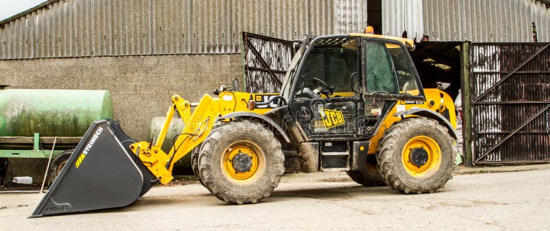 Construction Digger Loader in Farm Yard with Barn Editorial Photography ...