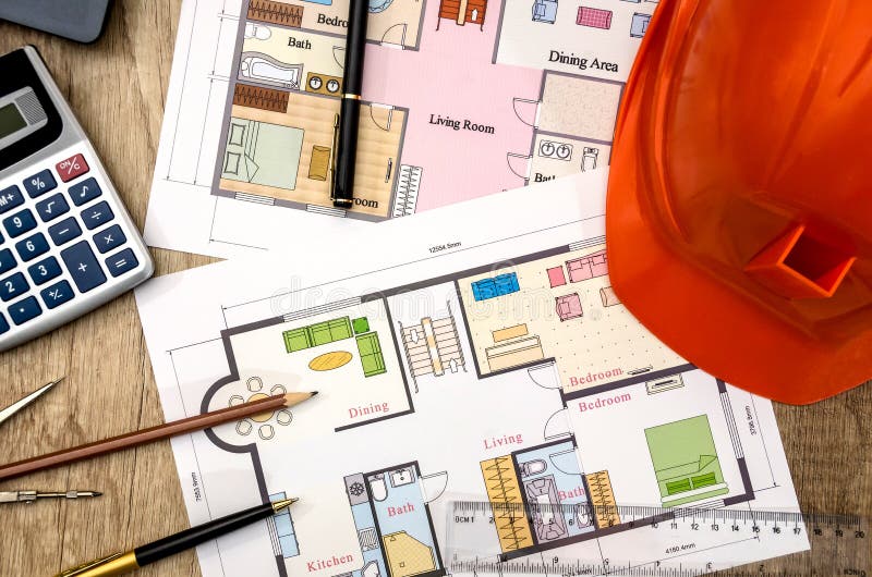 Construction Drawing with a Calculator and a Helmet on the Table Stock ...