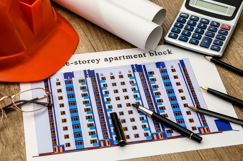 Construction Drawing with a Calculator and a Helmet on the Table Stock ...
