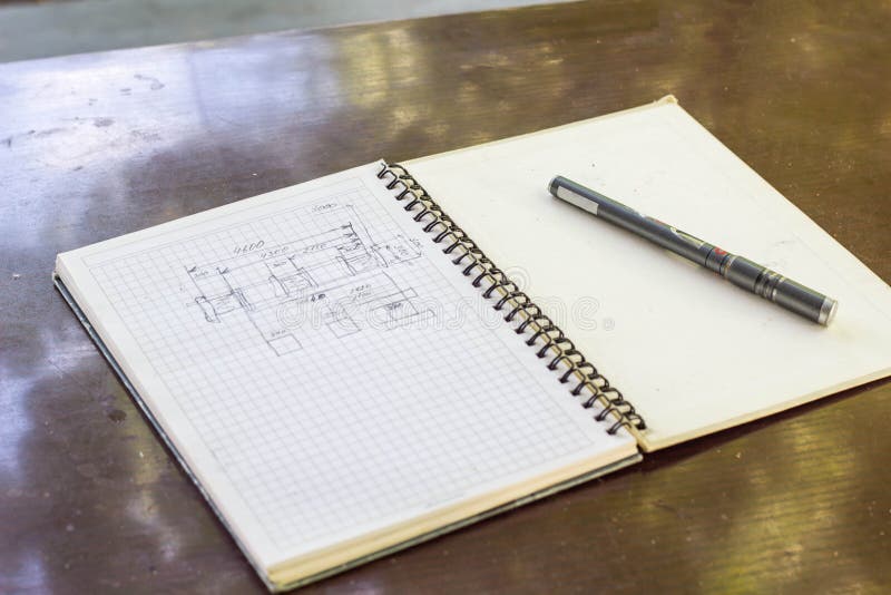 Construction Drawing in the Notebook with Pen Stock Photo - Image of ...