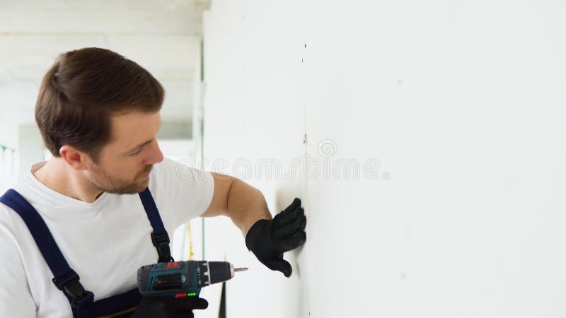 Construction Drywall Worker Installing Plasterboard Sheet To Wall ...