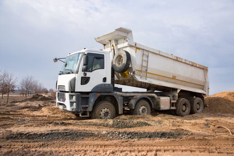 Construction Dump Truck Performs Excavation Work on a Construction Site ...