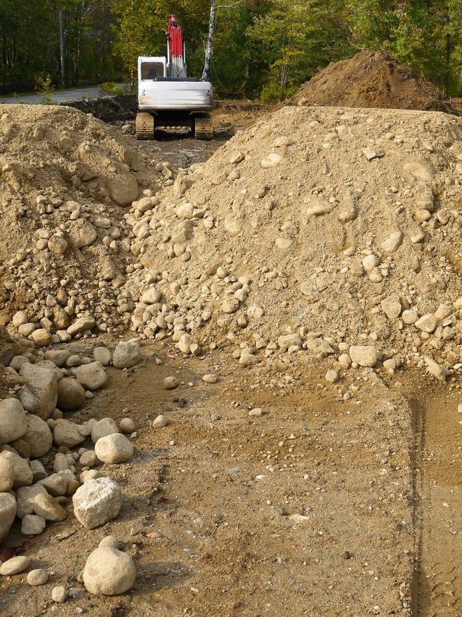 Construction: Earth Piles and Backhoe V Stock Image - Image of heavy ...