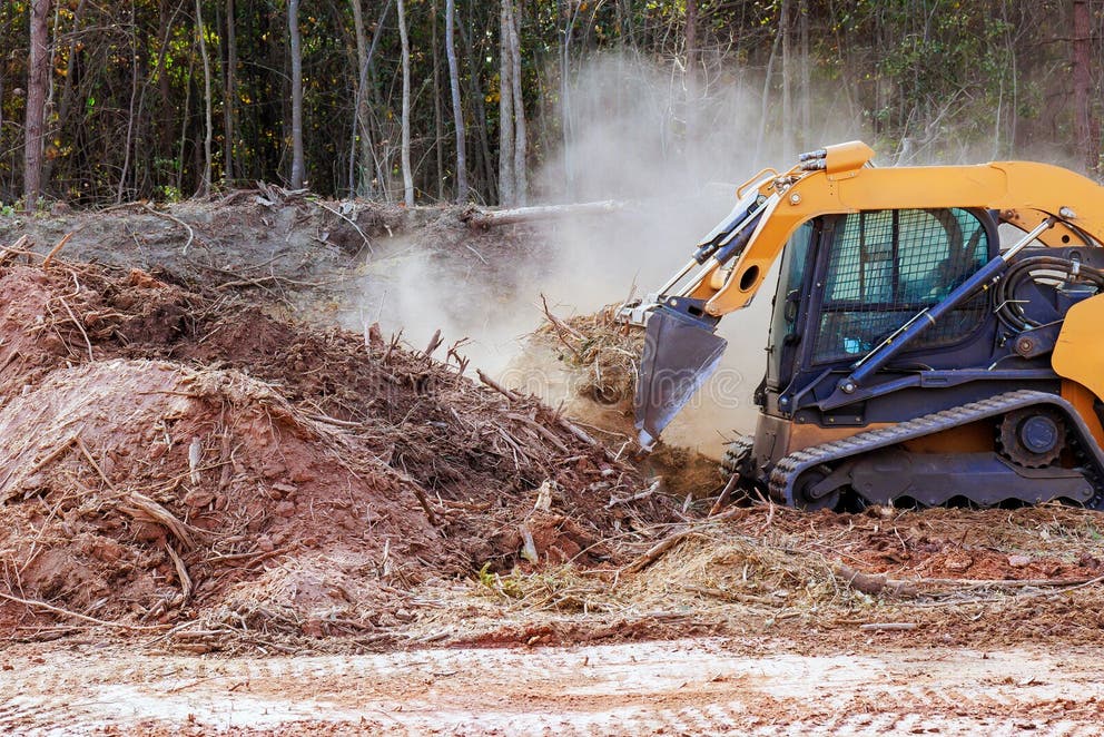 During Construction, an Earthmoving Small Mini Tractor is Leveling a ...