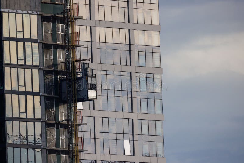 Construction Elevator on the Side of a High Rise Building Stock Image ...