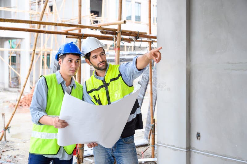 Construction Engineer and Architect Check Plan Working with the ...