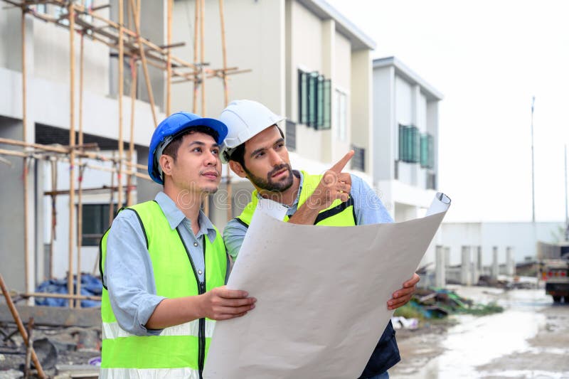 Construction Engineer and Architect Check Plan Working with the ...