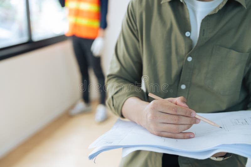 Construction Engineer with Architect Team Working Check Building ...