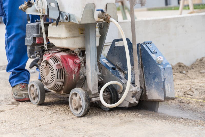 Construction Engineer with Asphalt Cutting Machine - Construction Site ...