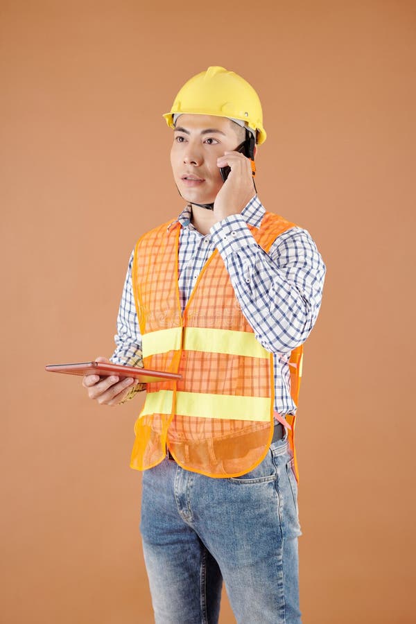 Construction Engineer Calling Coworker Stock Photo - Image of skill ...