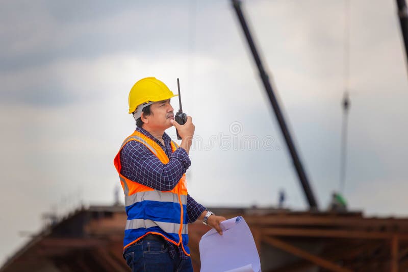 Construction Engineer Checking Project at the Building Site, Architect ...