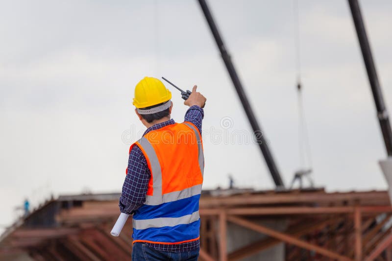 Construction Engineer Checking Project at the Building Site, Architect ...