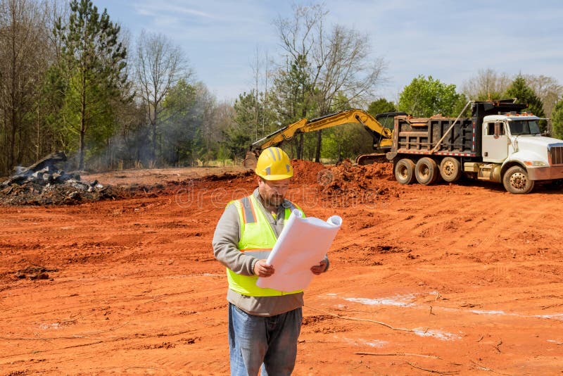 Construction Engineer Checks New Home Construction Using Construction ...