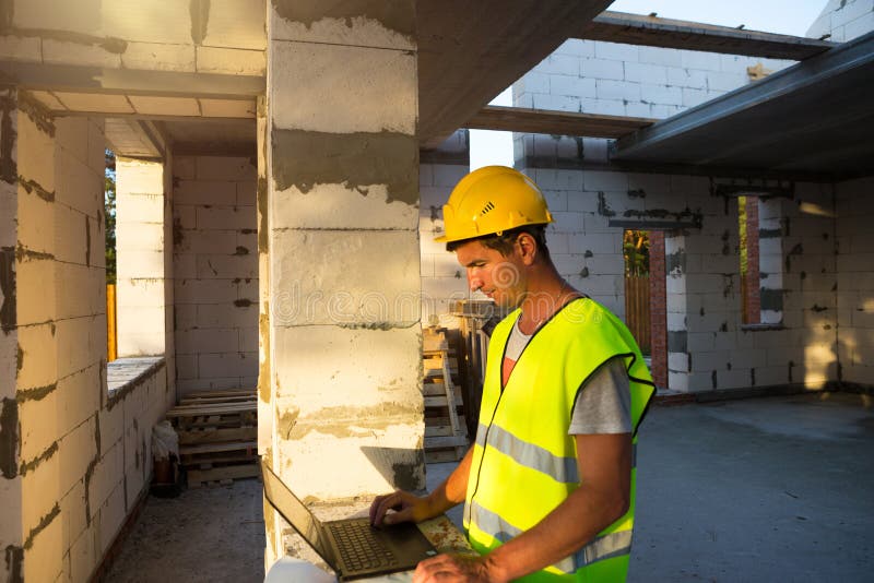 Construction Engineer on the Construction Site of a House Made of ...