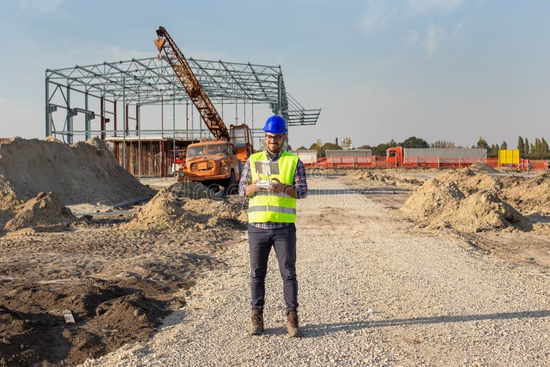 Construction Engineer with Drone at Building Site Stock Image - Image ...