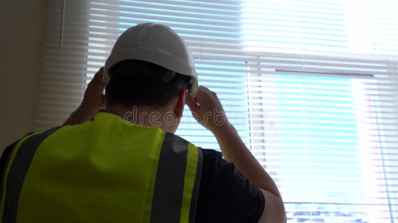 A Construction Engineer Foreman Oversees the Project and Writes Down ...