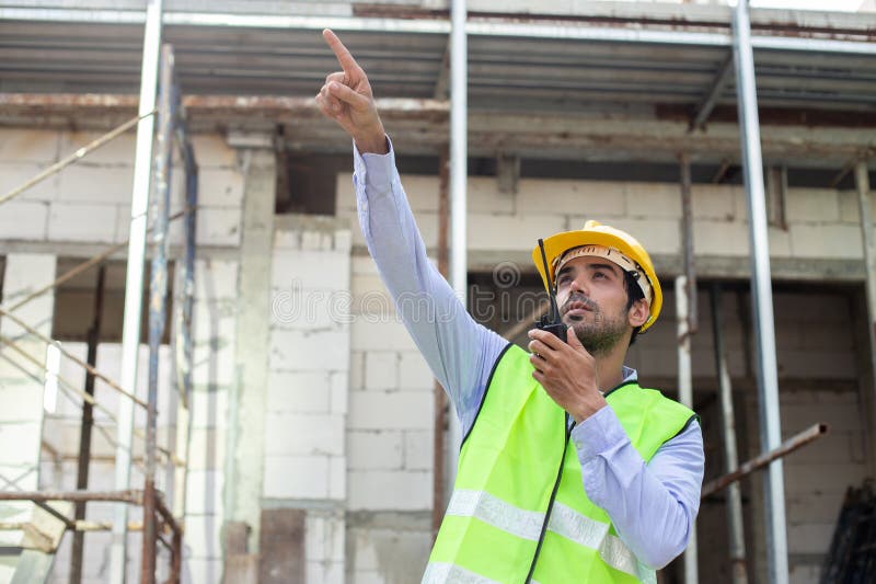 Construction Engineer. Happy Man Engineer Wear Uniform Uing Walkie ...