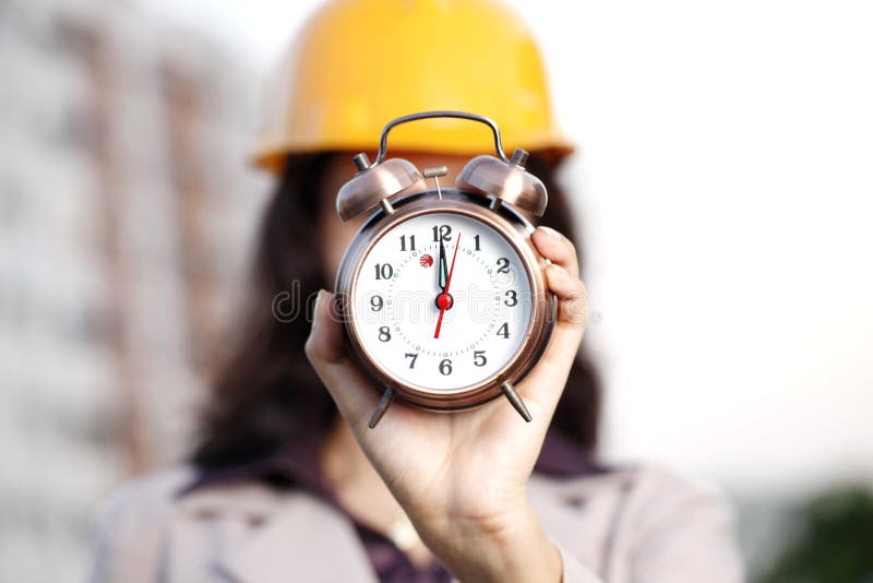 Construction Engineer Holding Alarm Clock Stock Image - Image of ...