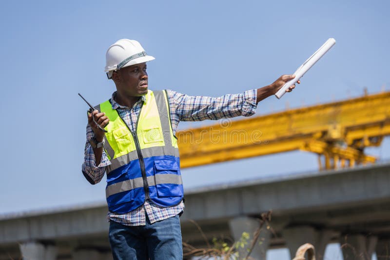 Construction Engineer Holding Blueprint at Construction Site, Foreman ...