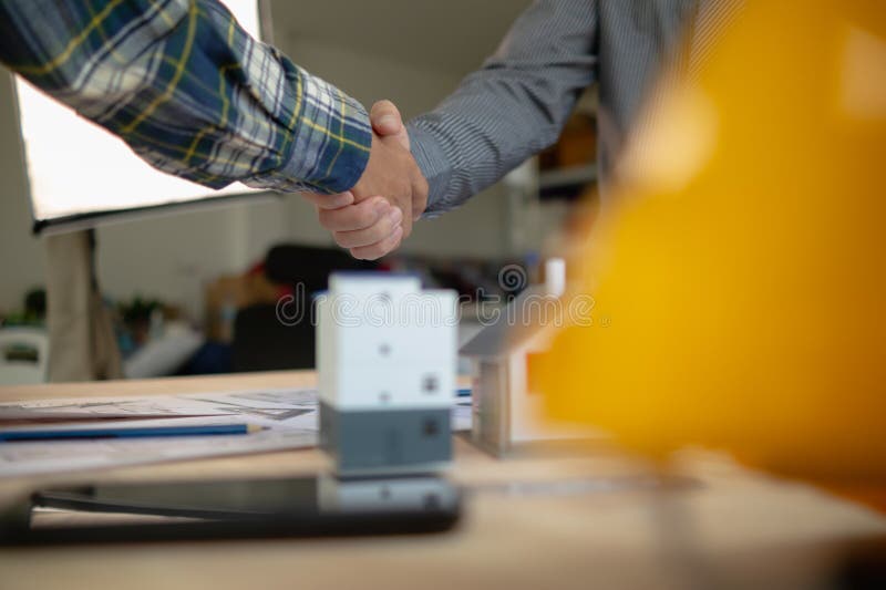 Construction Engineer Joins Hands with Architect To Congratulate ...