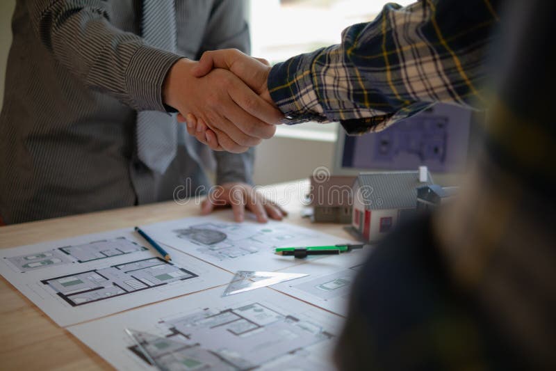Construction Engineer Joins Hands with Architect To Congratulate ...
