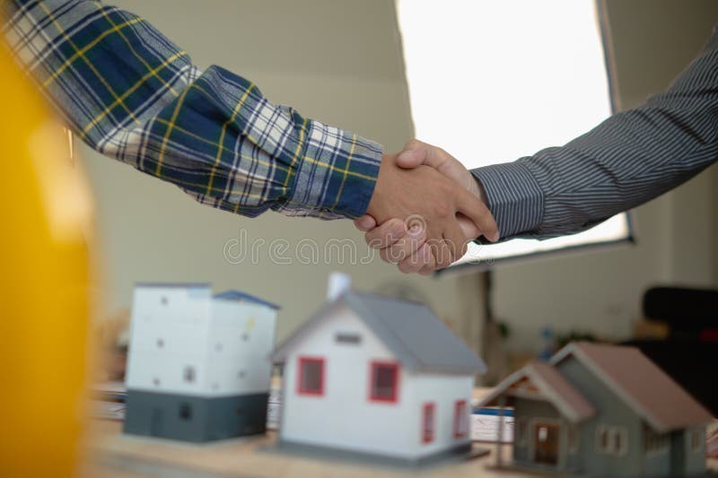 Construction Engineer Joins Hands with Architect To Congratulate ...